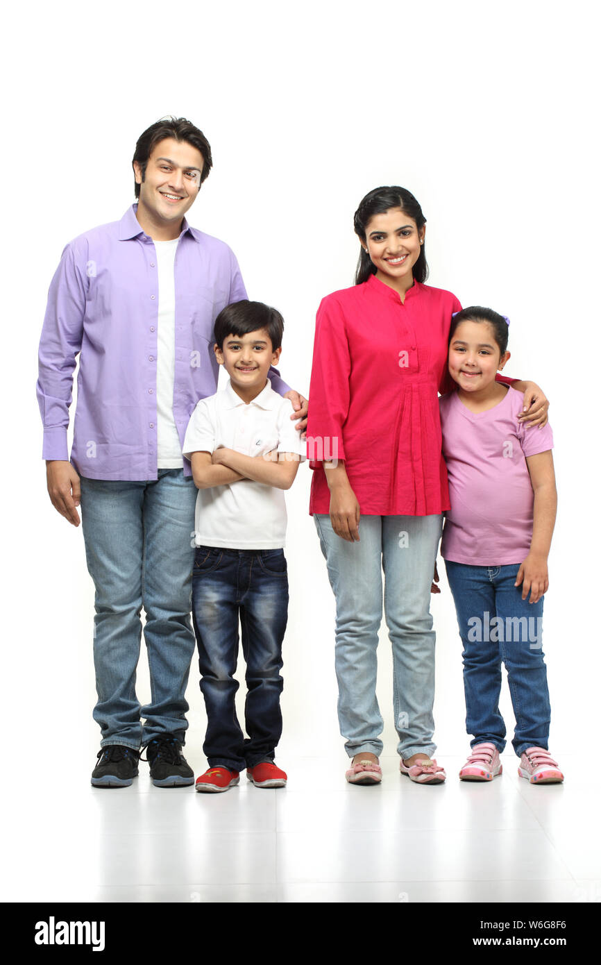 Family standing together Stock Photo - Alamy