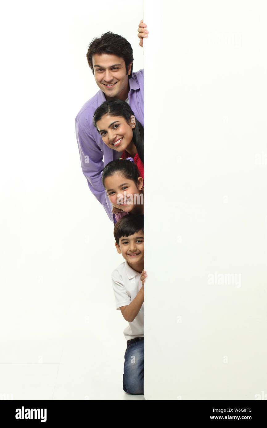 Woman hiding behind wall a watching hi-res stock photography and images ...