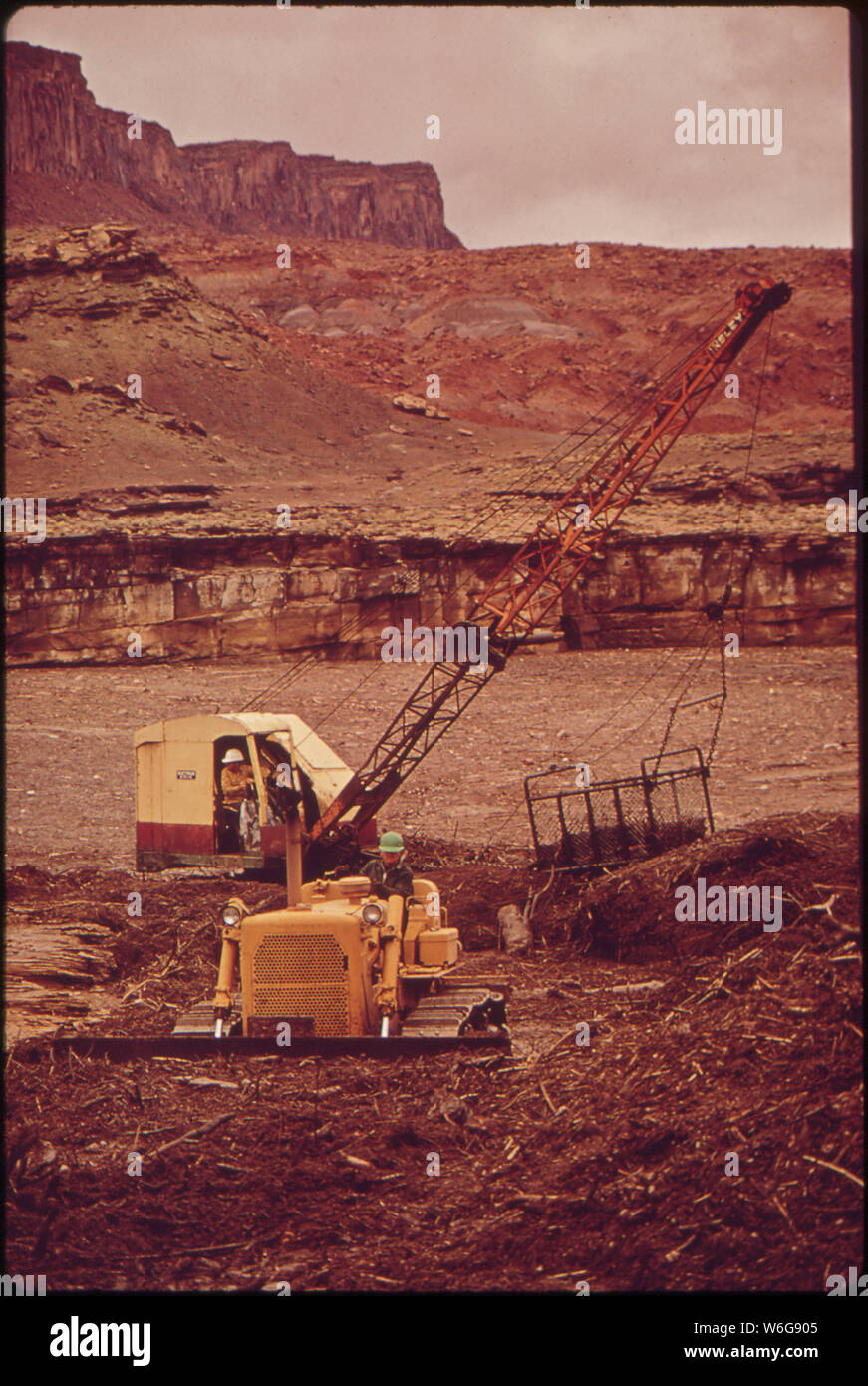 DRAGLINE SCOOPS UP OIL-LADEN DEBRIS ON THE SAN JUAN RIVER FOLLOWING ...