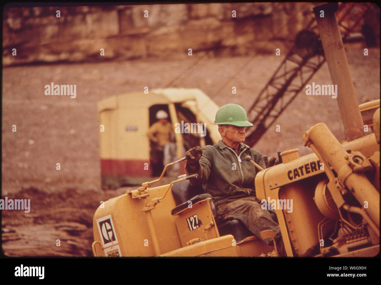 DRAGLINE AND WORKERS AT SITE OF OIL SPILL CLEAN-UP OPERATIONS ON THE ...