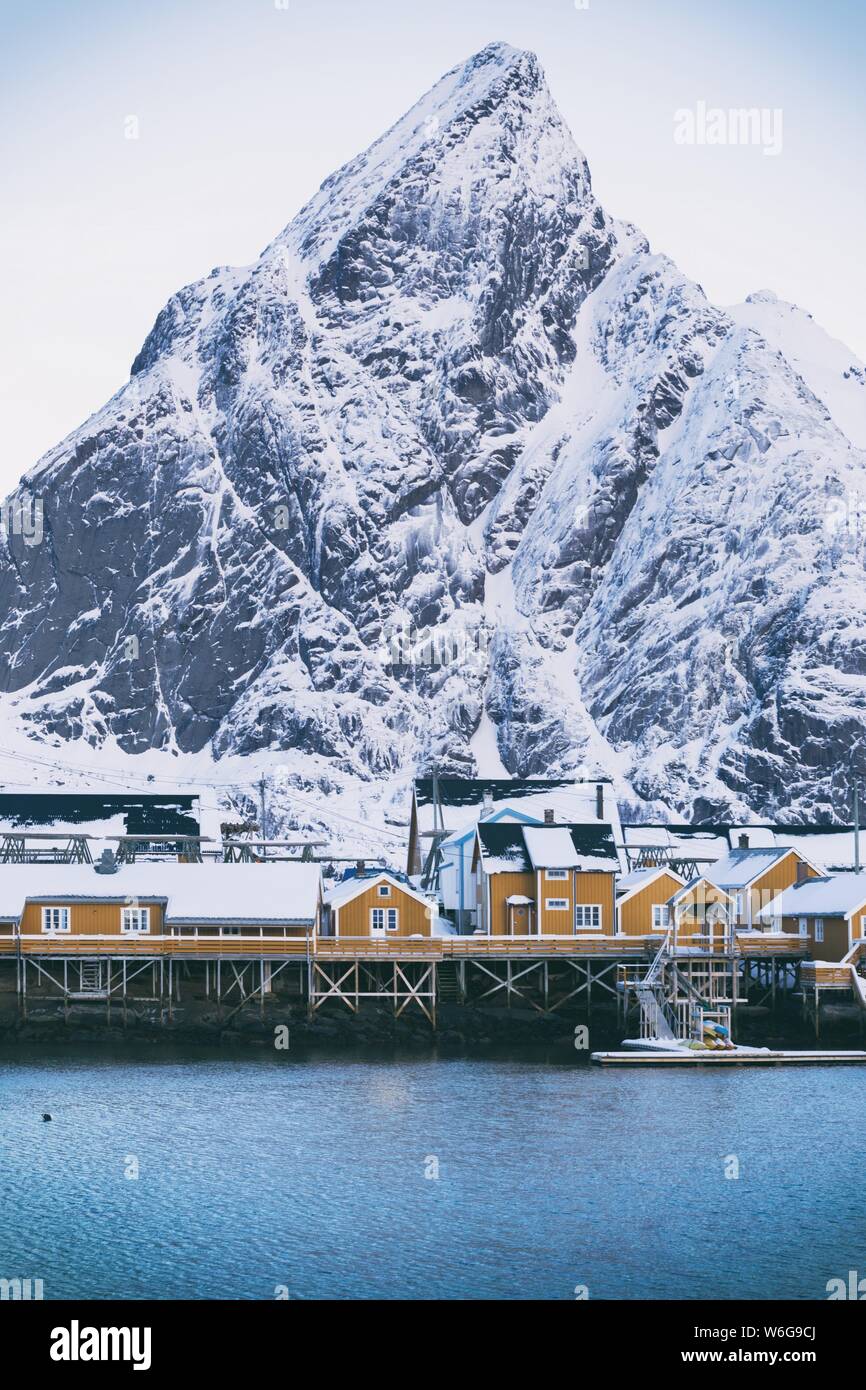 traditional norwegian wooden house rorbu to stand on the shore of the ...