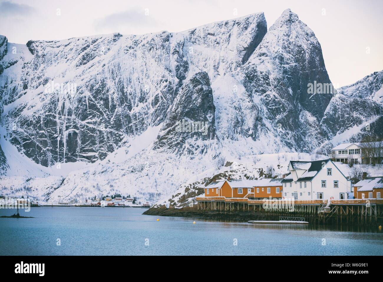 traditional norwegian wooden house rorbu to stand on the shore of the ...