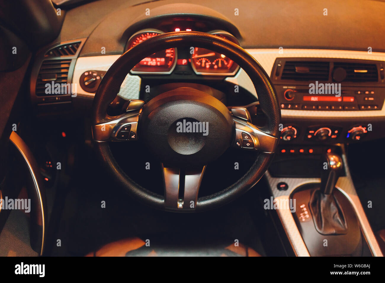 The steering wheel and the instrument panel on the dashboard of the car ...