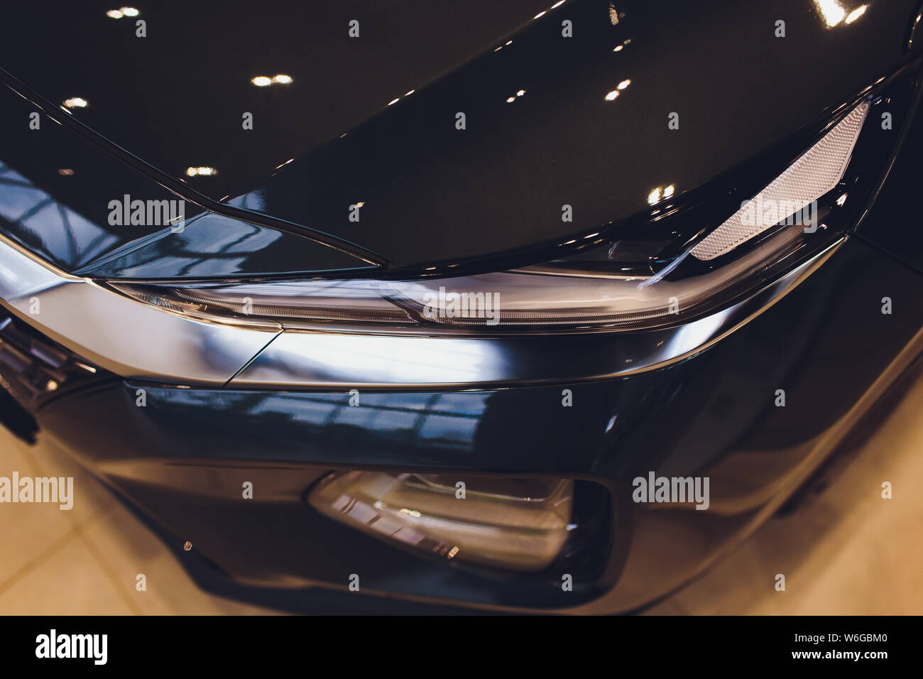 Close up of headlight detail of modern luxury car with projector lens ...