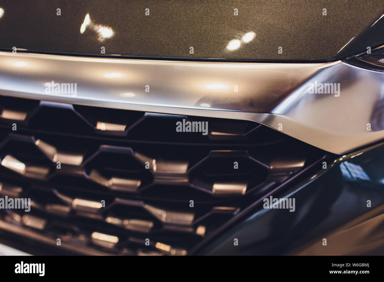 Grid of car with sunflare. Radiator grille. Metal close-up texture ...
