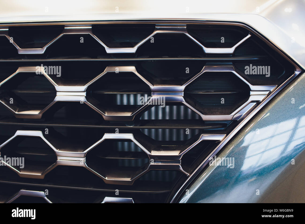 Grid of car with sunflare. Radiator grille. Metal close-up texture ...