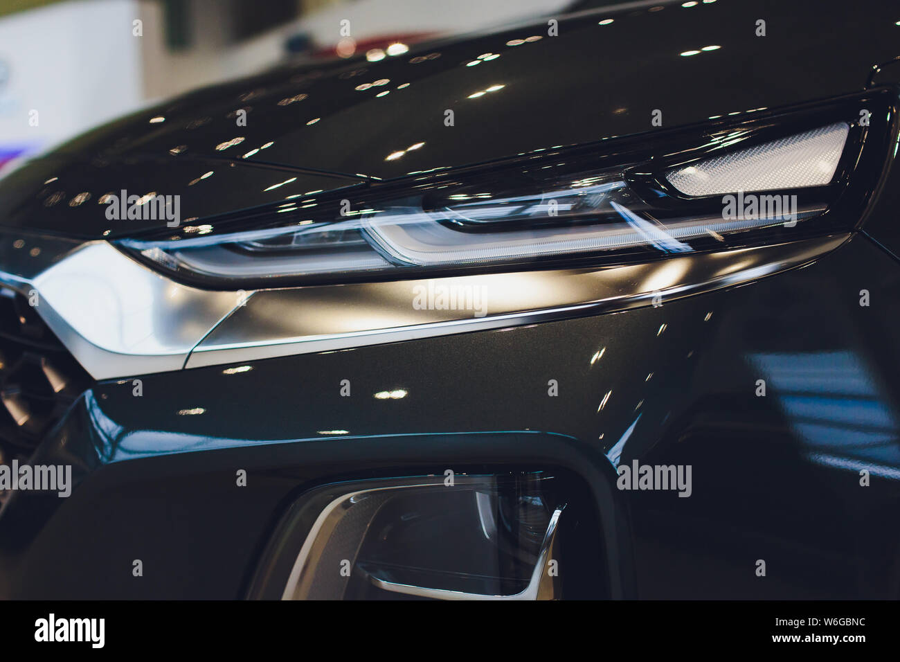 Close up of headlight detail of modern luxury car with projector lens ...
