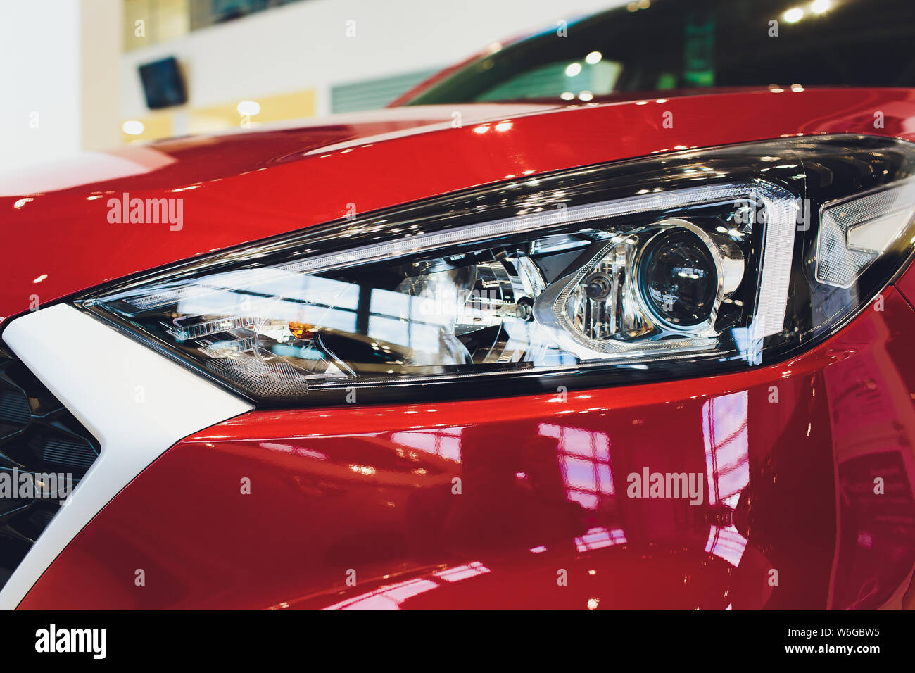 Close up of headlight detail of modern luxury car with projector lens ...