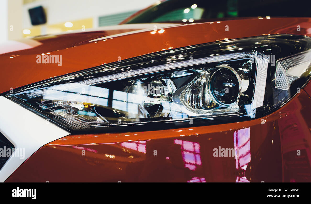Close up of headlight detail of modern luxury car with projector lens ...