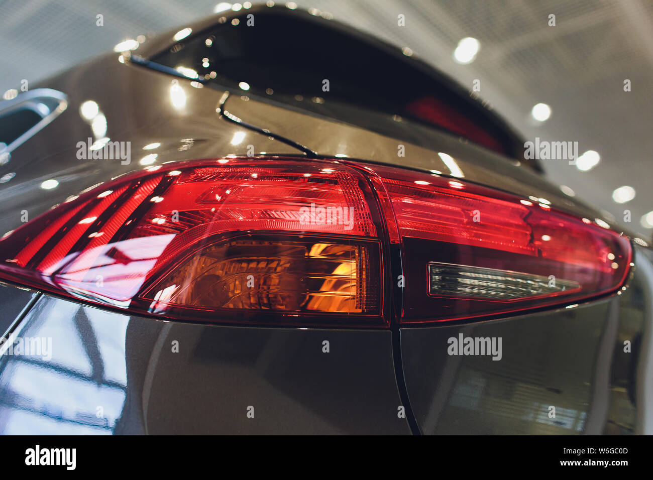 Close up of rear lights detail of modern luxury car with projector lens ...