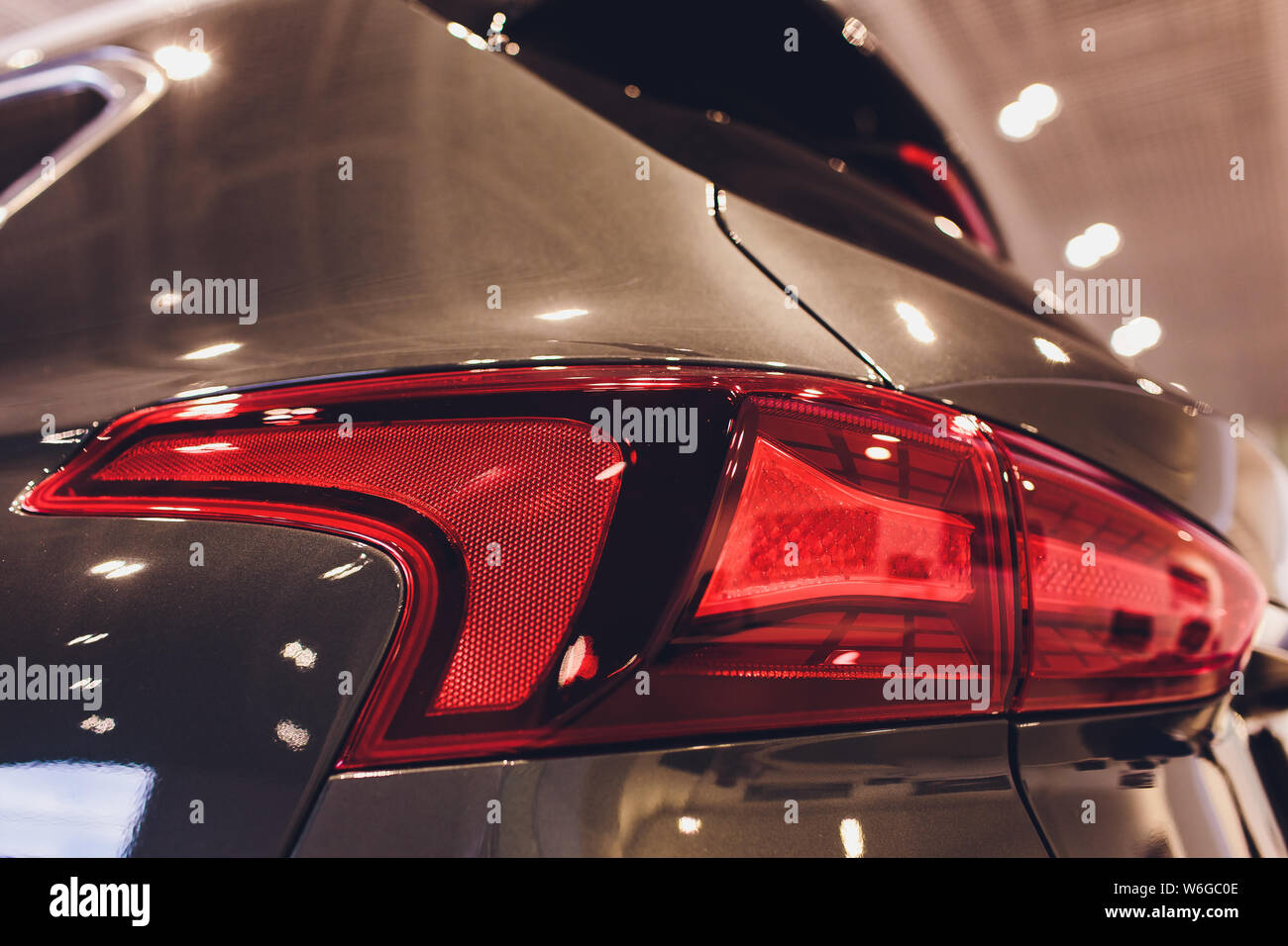 Close up of rear lights detail of modern luxury car with projector lens ...