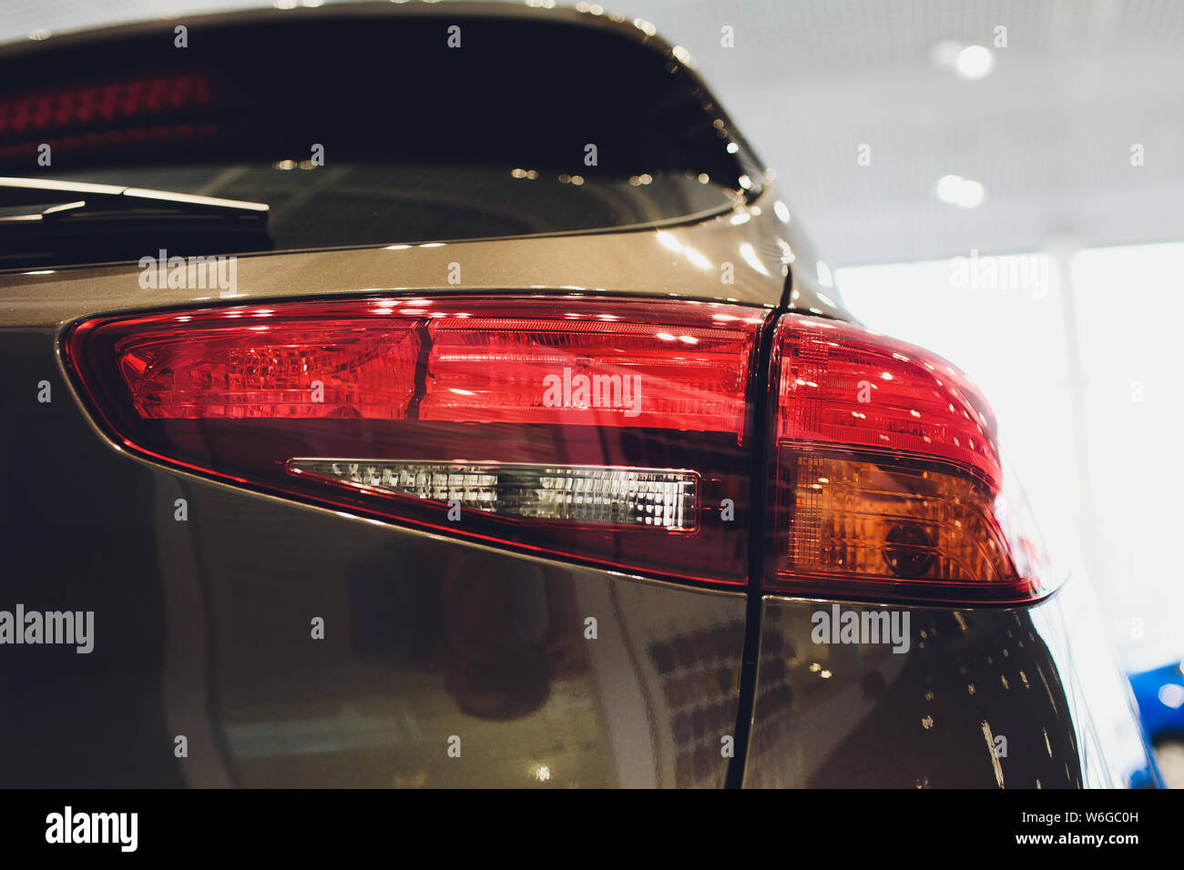 Close up of rear lights detail of modern luxury car with projector lens ...