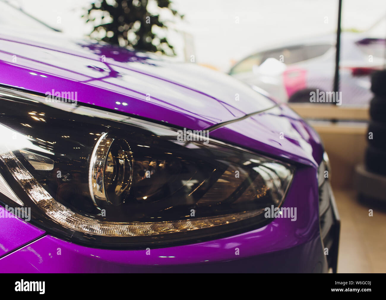 Close up of headlight detail of modern luxury car with projector lens ...