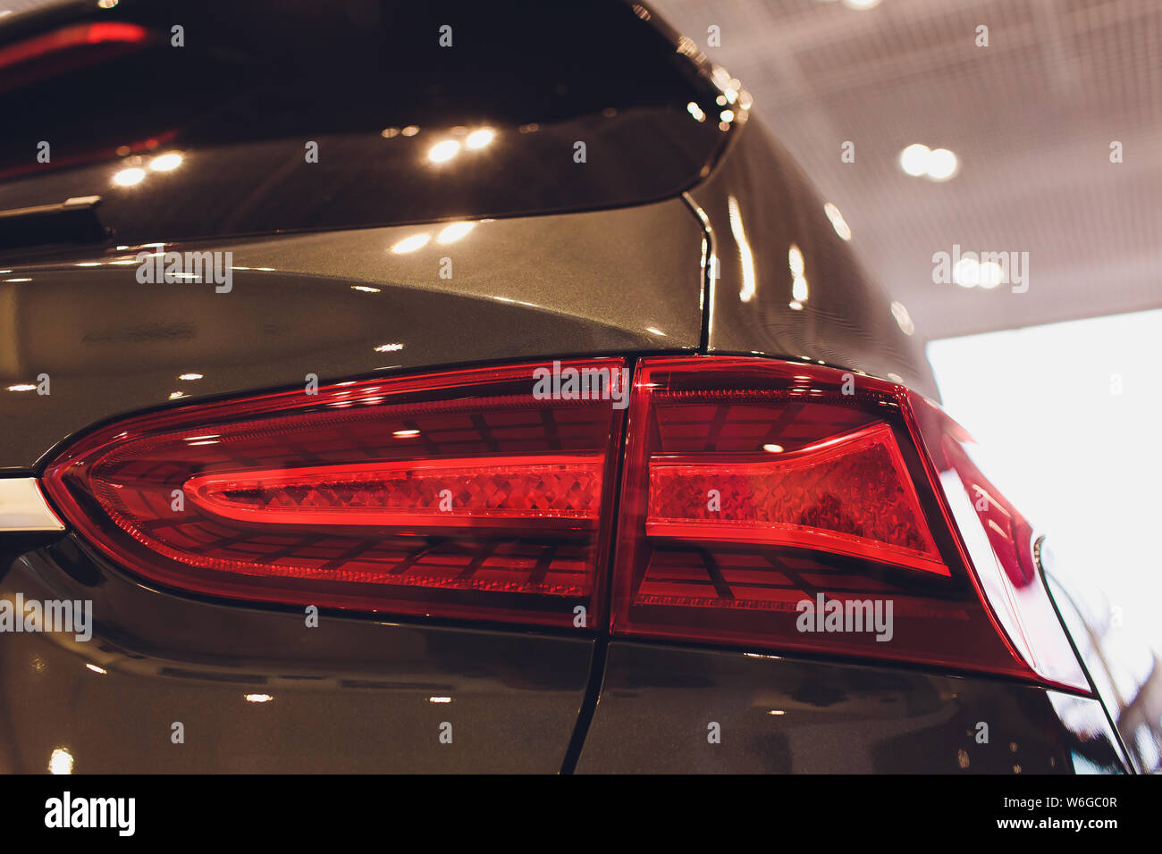 Close up of rear lights detail of modern luxury car with projector lens ...