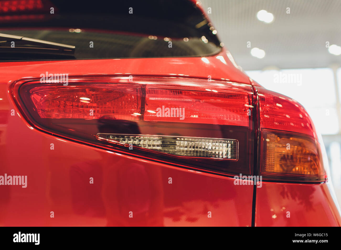 Close up of rear lights detail of modern luxury car with projector lens ...