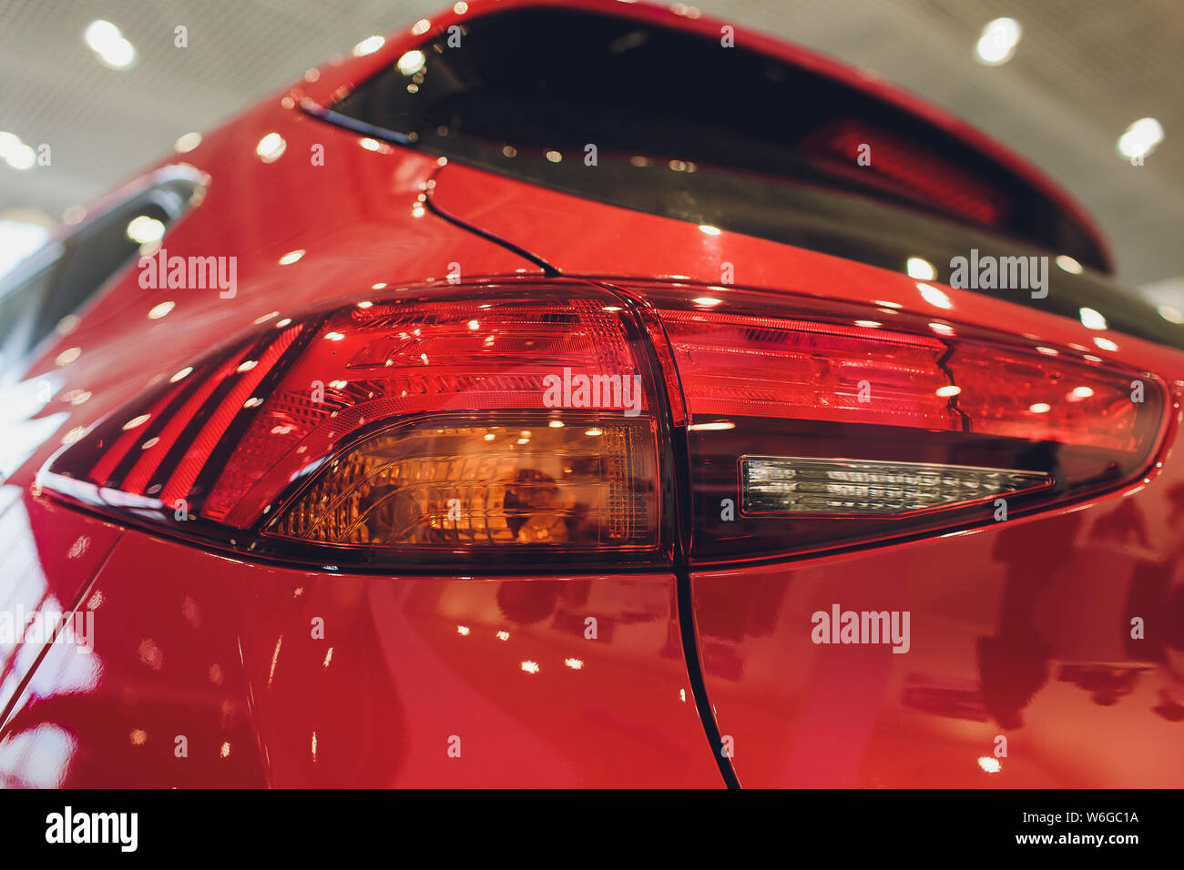 Close up of rear lights detail of modern luxury car with projector lens ...