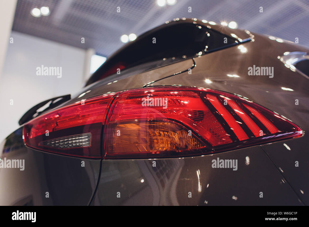 Close up of rear lights detail of modern luxury car with projector lens ...