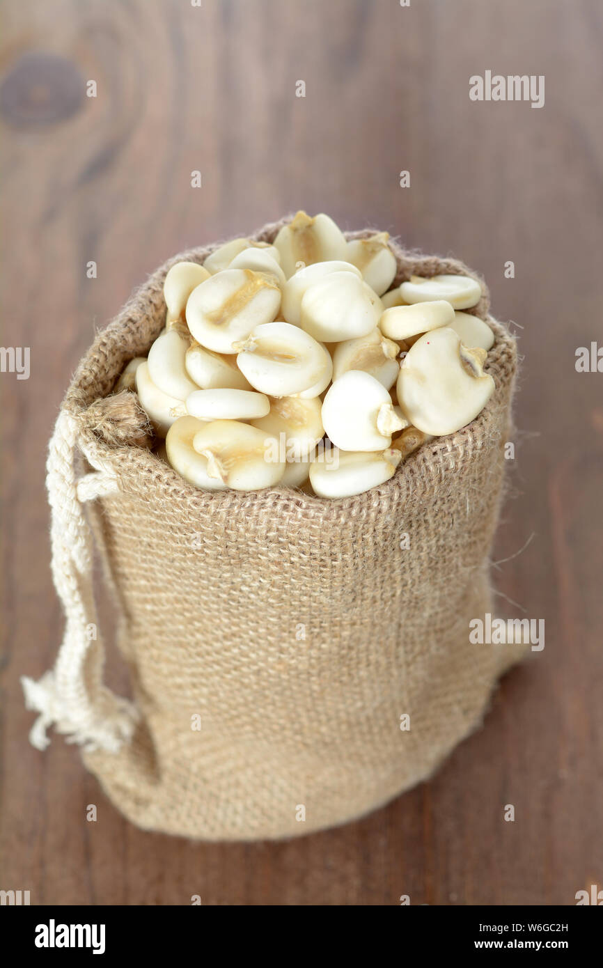 pile of giant white corn in burlap bag Stock Photo - Alamy