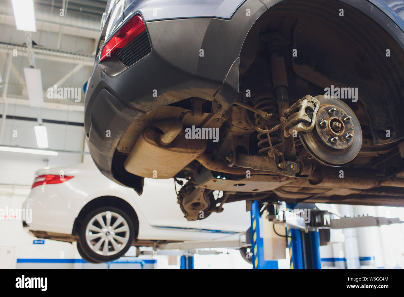 Auto raised car lift in hi-res stock photography and images - Alamy