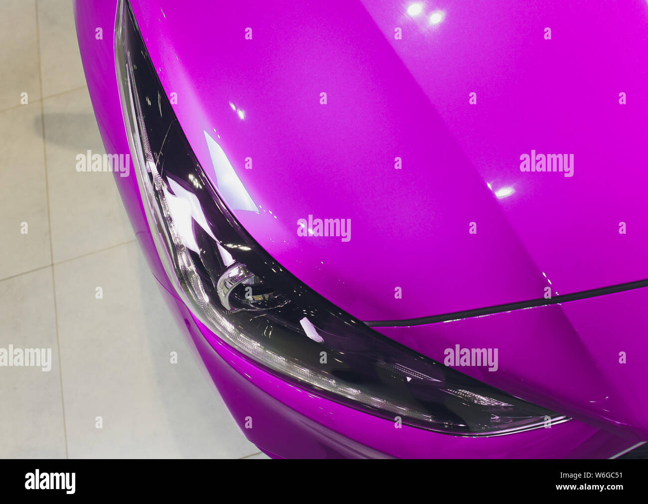 Close up of headlight detail of modern luxury car with projector lens ...