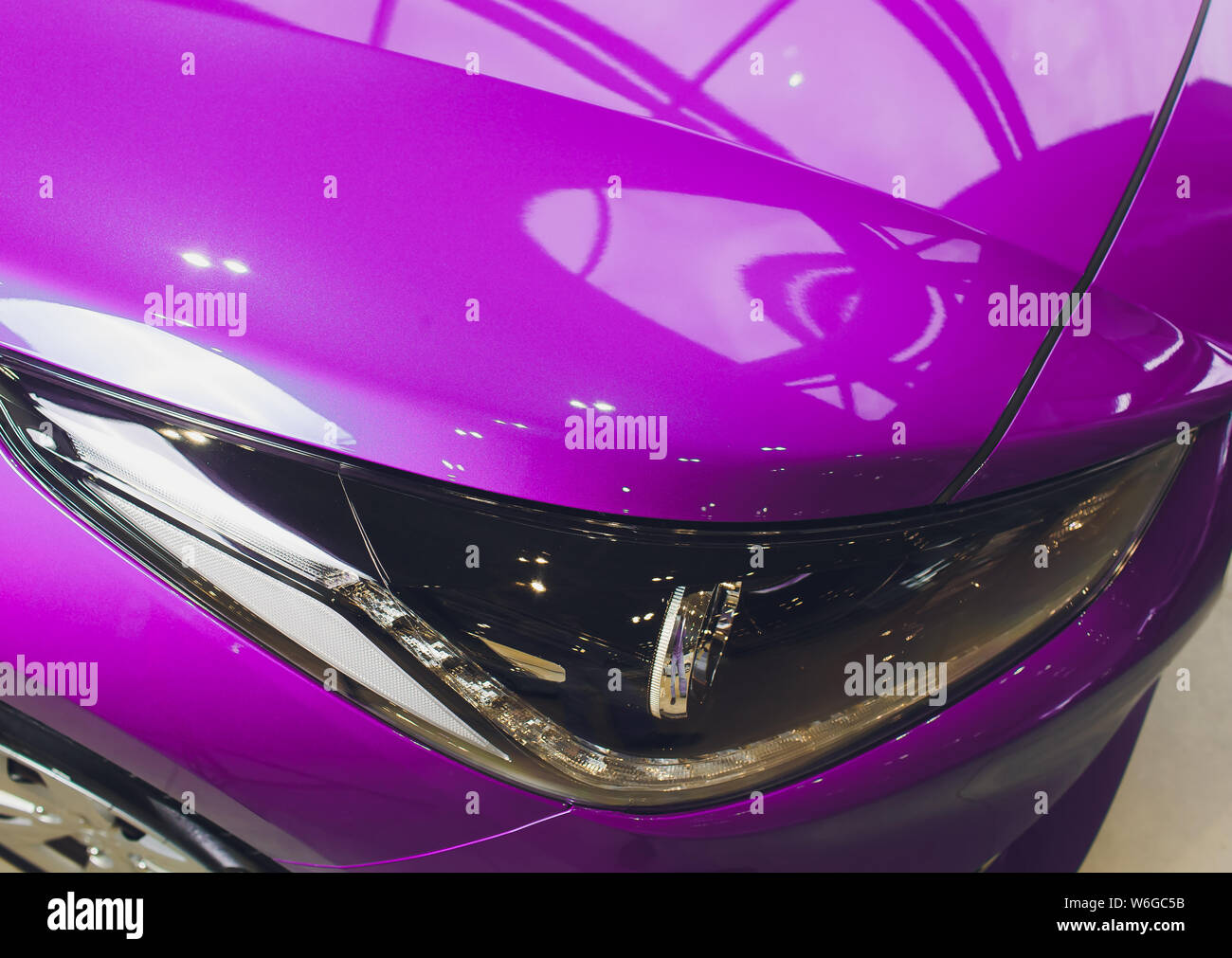 Close up of headlight detail of modern luxury car with projector lens ...