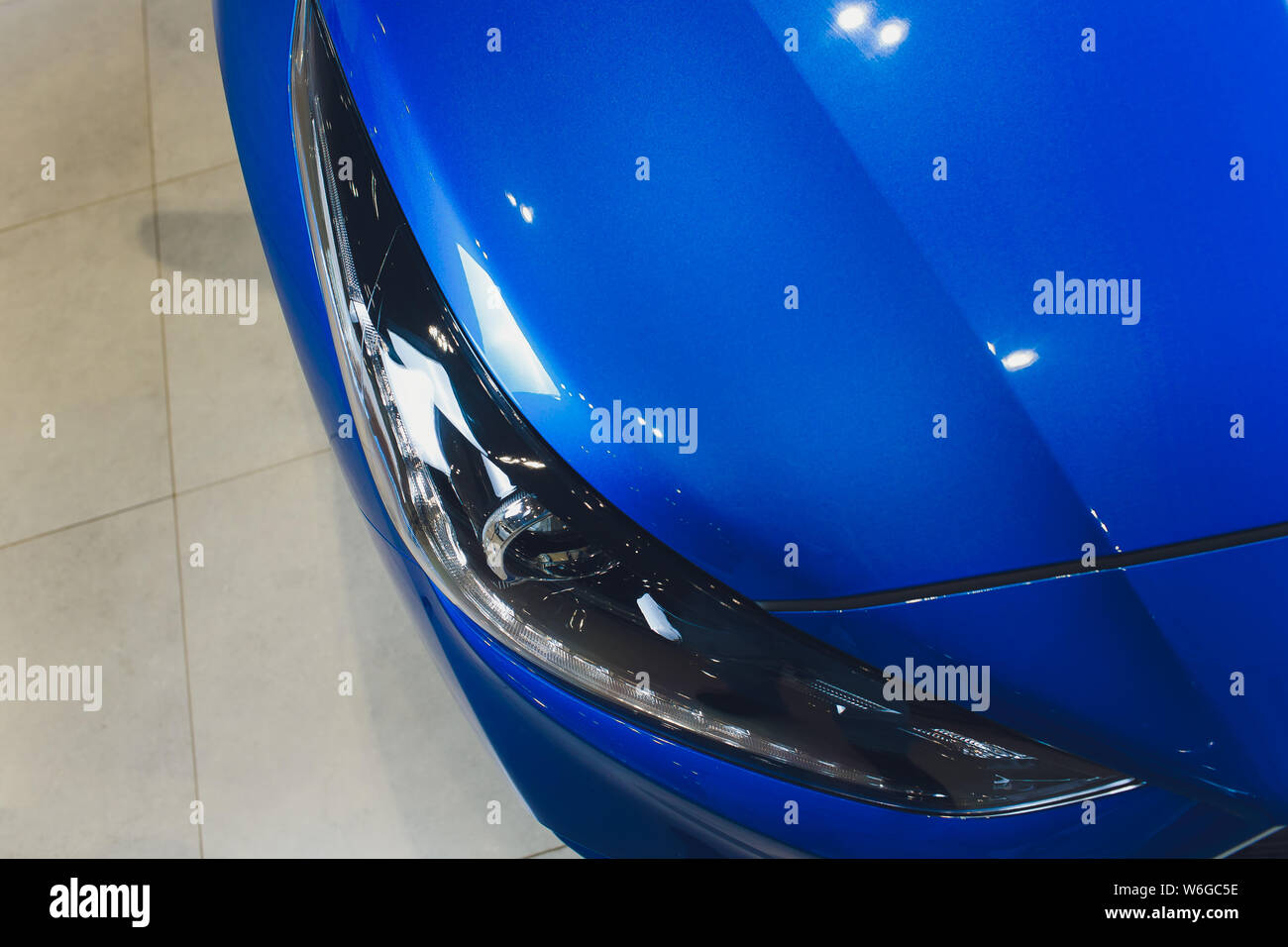 Close up of headlight detail of modern luxury car with projector lens ...