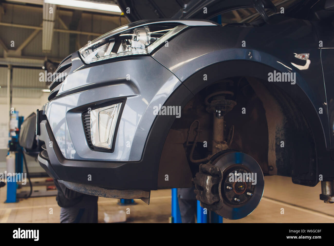 Auto raised car lift in hi-res stock photography and images - Alamy