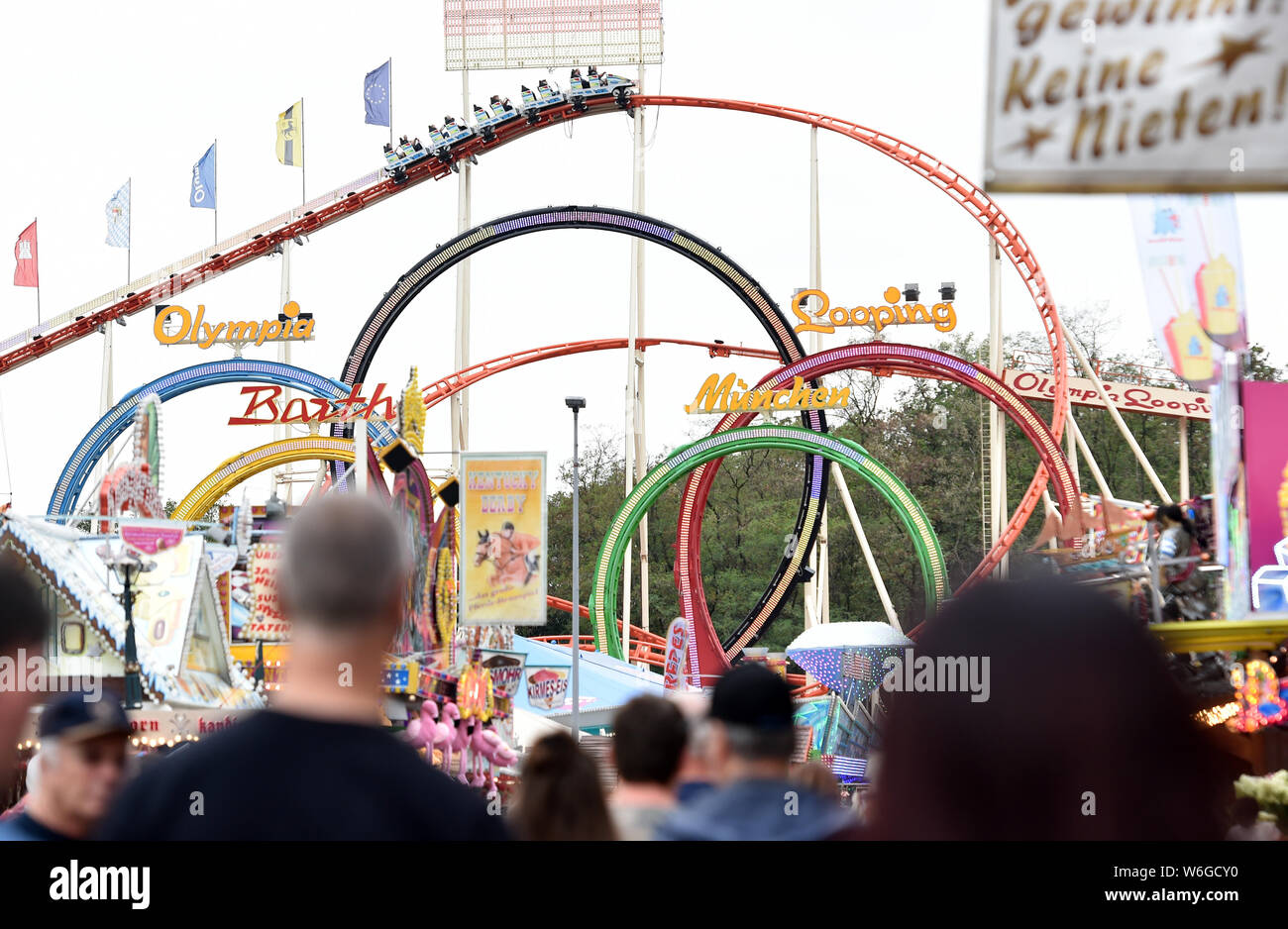 Herne, Germany. 01st Aug, 2019. Visitors ride the Cranger Kirmes with ...