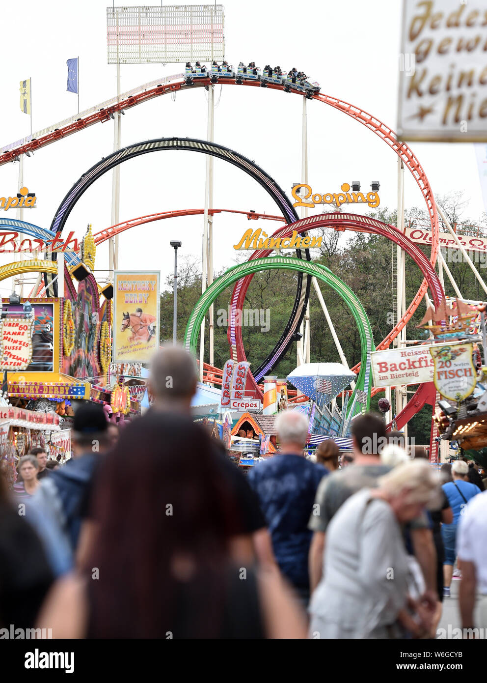 Herne, Germany. 01st Aug, 2019. Visitors ride the Cranger Kirmes with ...