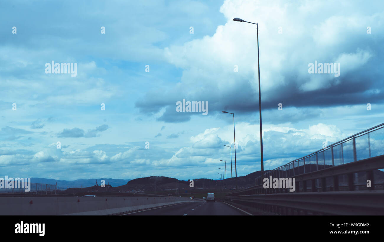 Electric light poles on highway with cinematic look Stock Photo - Alamy