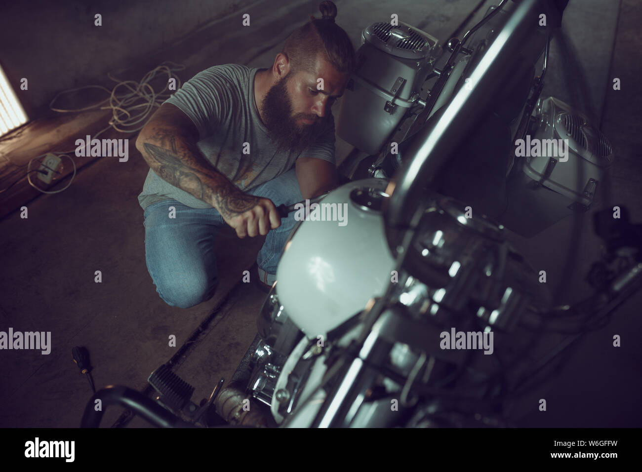 Man repairing a small motor hi-res stock photography and images - Alamy