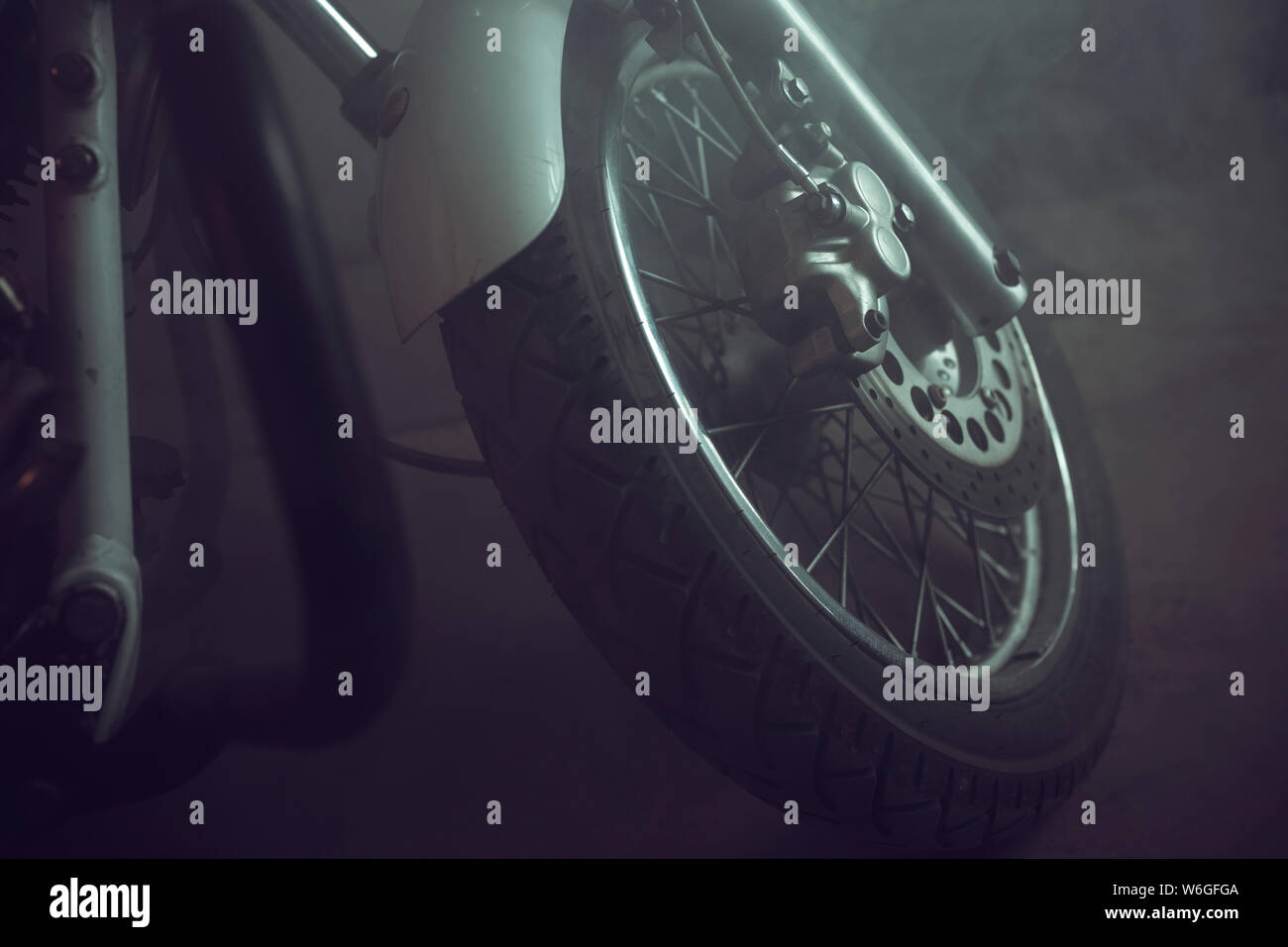 motorcycle front wheel shrouded in smoke Stock Photo - Alamy