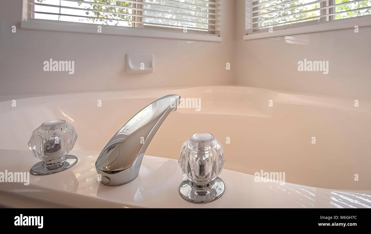 Panorama Polished bathtub with shiny faucet and double crystal handle ...