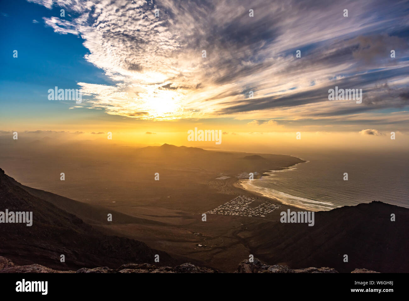 Amazing summer sunset over ocean resort beach Famara Lanzarote Canary ...