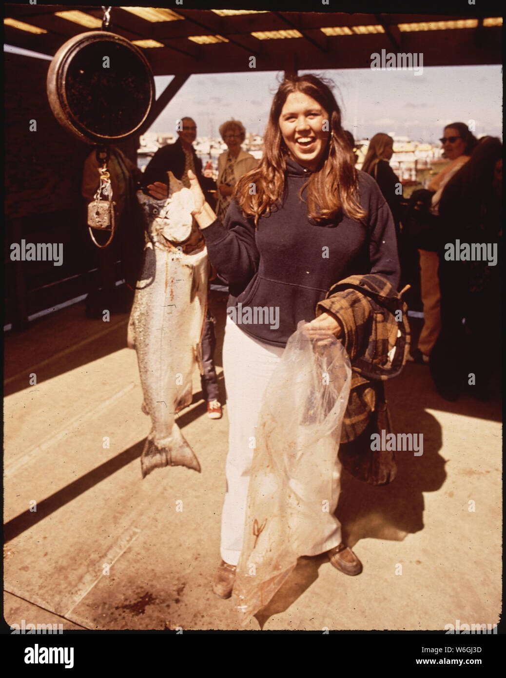 FISHER PERSON DISPLAYS SALMON CATCH Stock Photo - Alamy