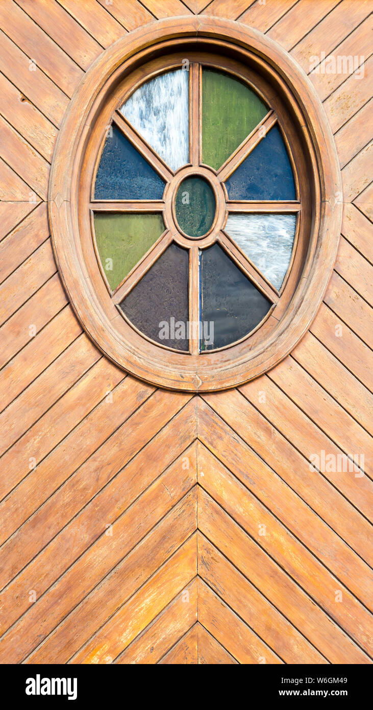 multi colored window in wooden door Stock Photo - Alamy