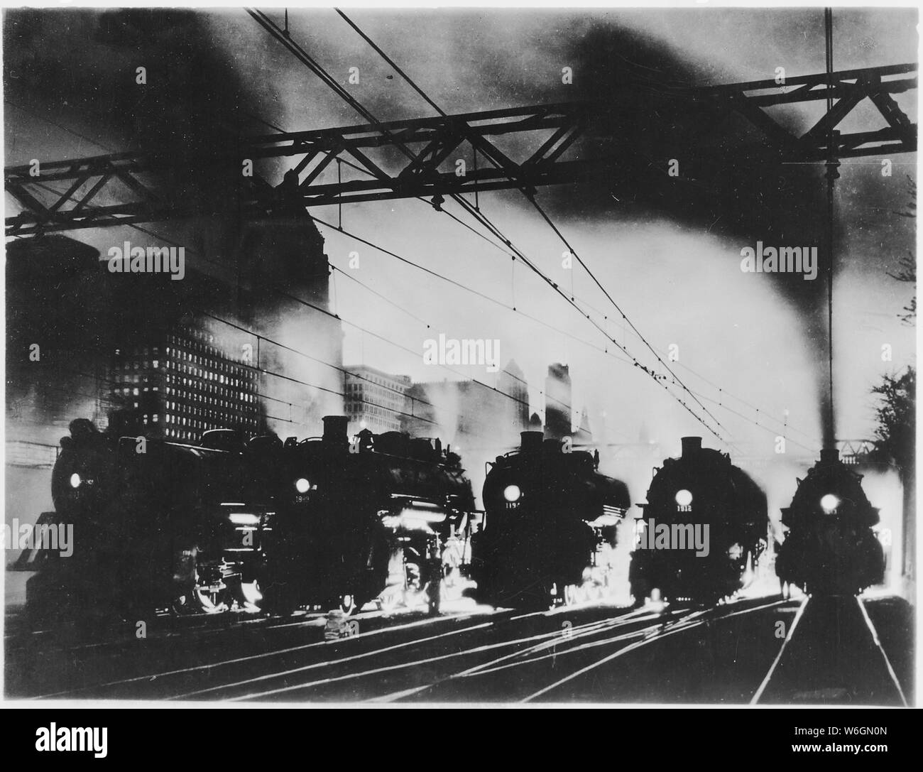 Five steam locomotives, side by side, outbound from Chicago at dusk, ca ...