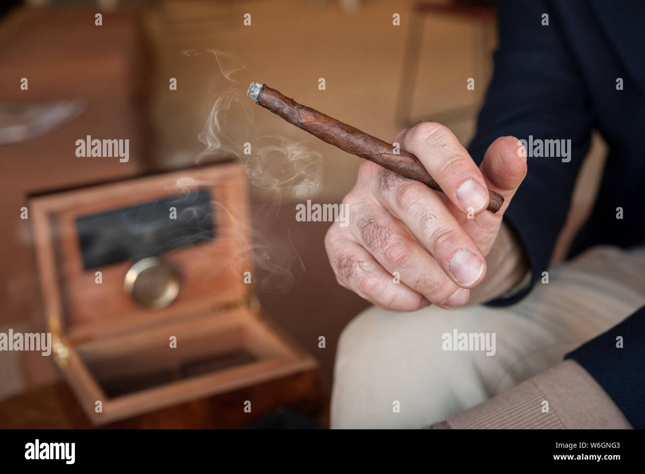 Smoker enjoing a traditional Tuscan cigar Stock Photo - Alamy