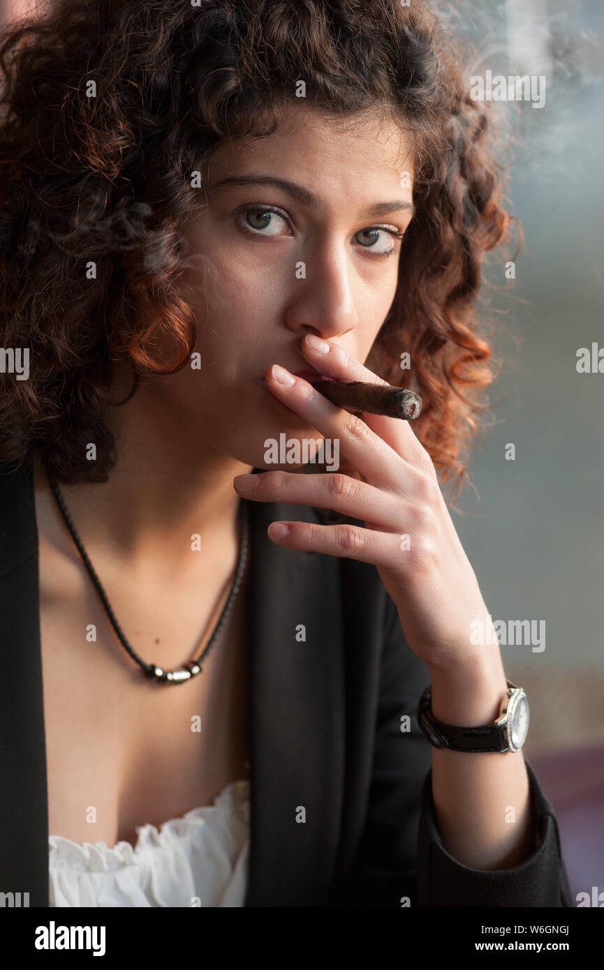 Girl smoking cigar hi-res stock photography and images - Alamy