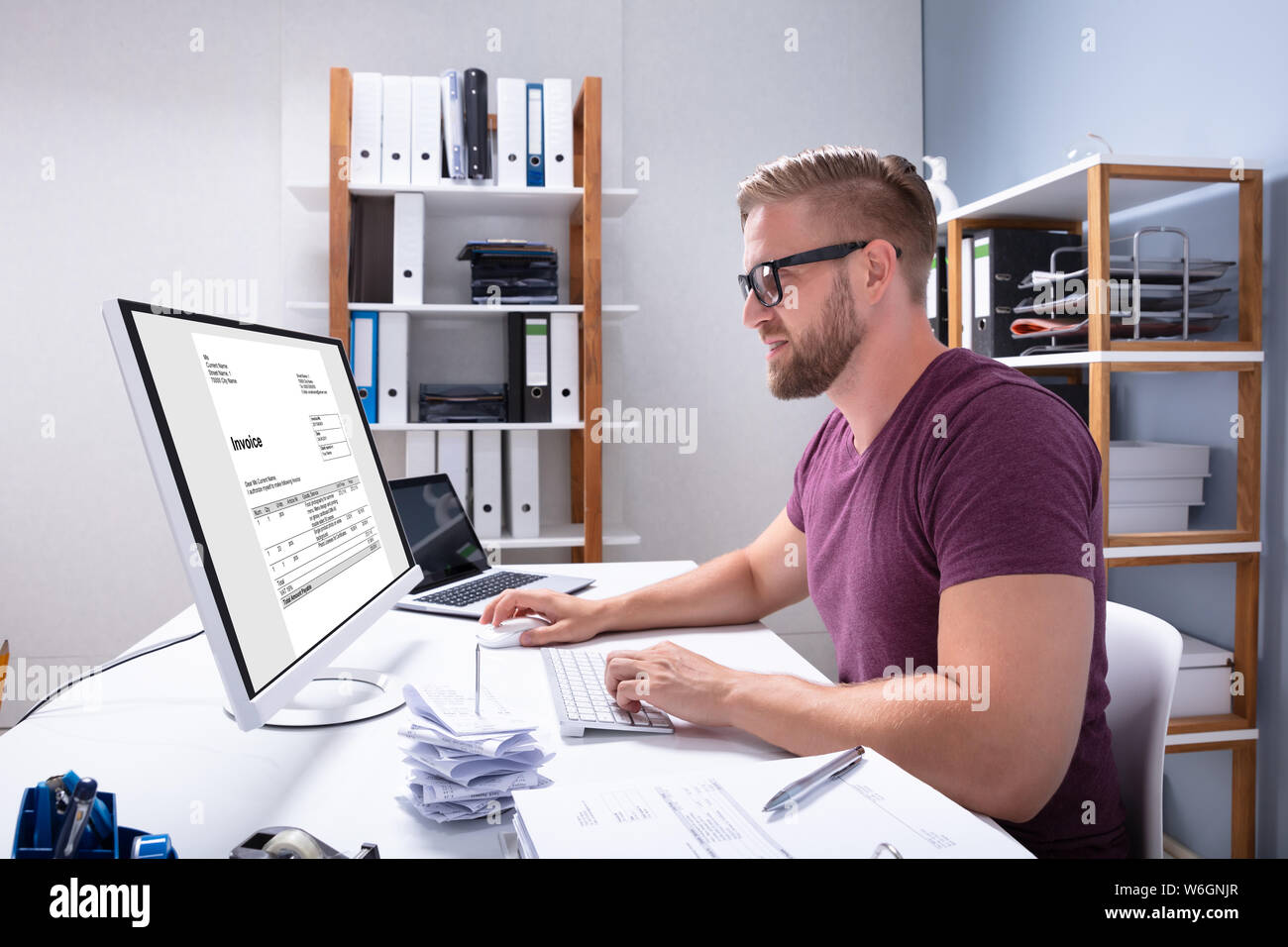 Close-up Of A Businessman Checking Invoice On Computer Stock Photo - Alamy