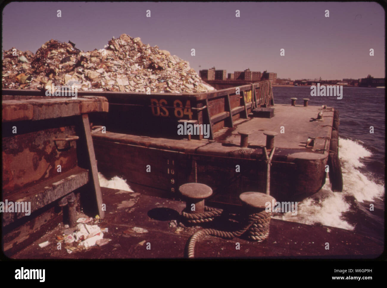 GARBAGE IS TOWED DOWN THE EAST RIVER TO STATEN ISLAND LANDFILL ...