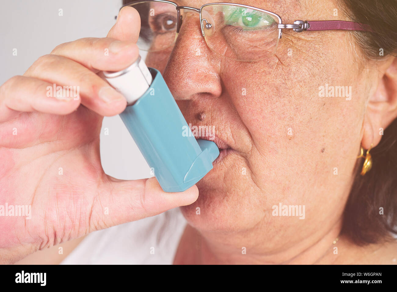 Old woman using asthma inhaler. Asthma Treatment, Elderly Person Stock ...