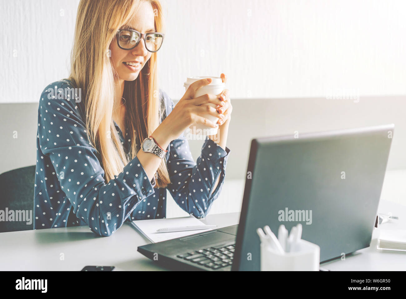 Happy cute pretty woman manager working with computer Stock Photo - Alamy