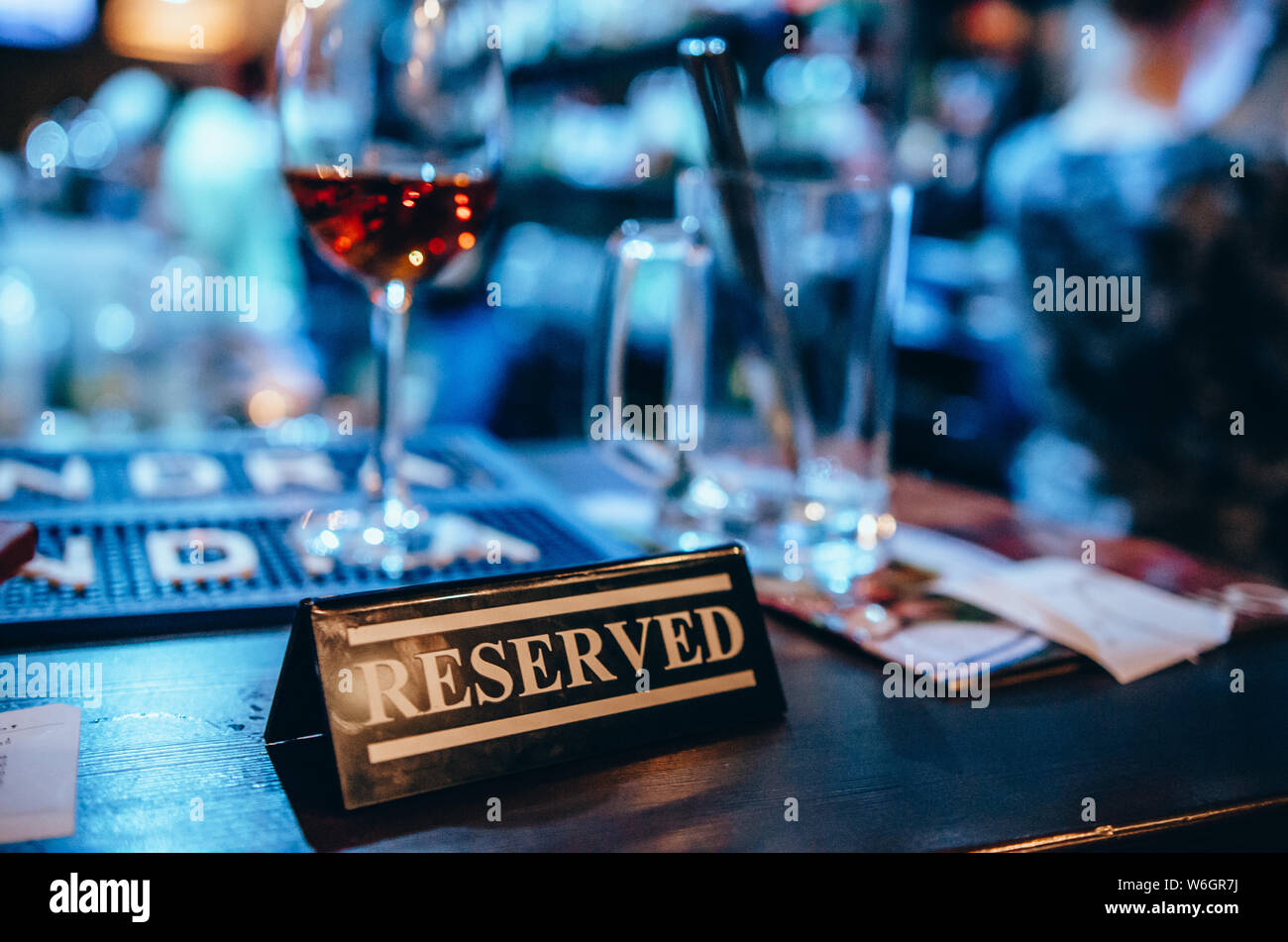 Plastic occupied sign on table in bar Stock Photo - Alamy
