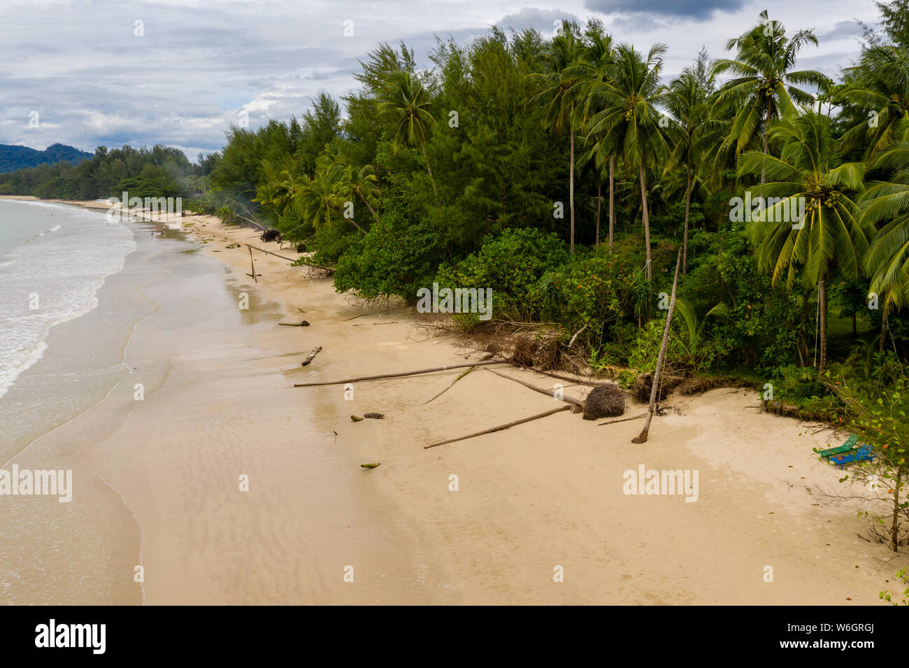 Aerial drone view of a beautiful empty tree lined tropical beach Stock ...