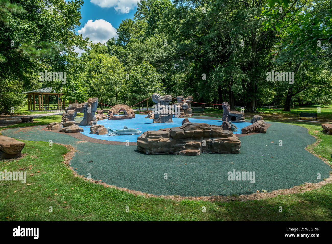 Playground with climbing outdoor themed structures canoe, fish, beaver ...