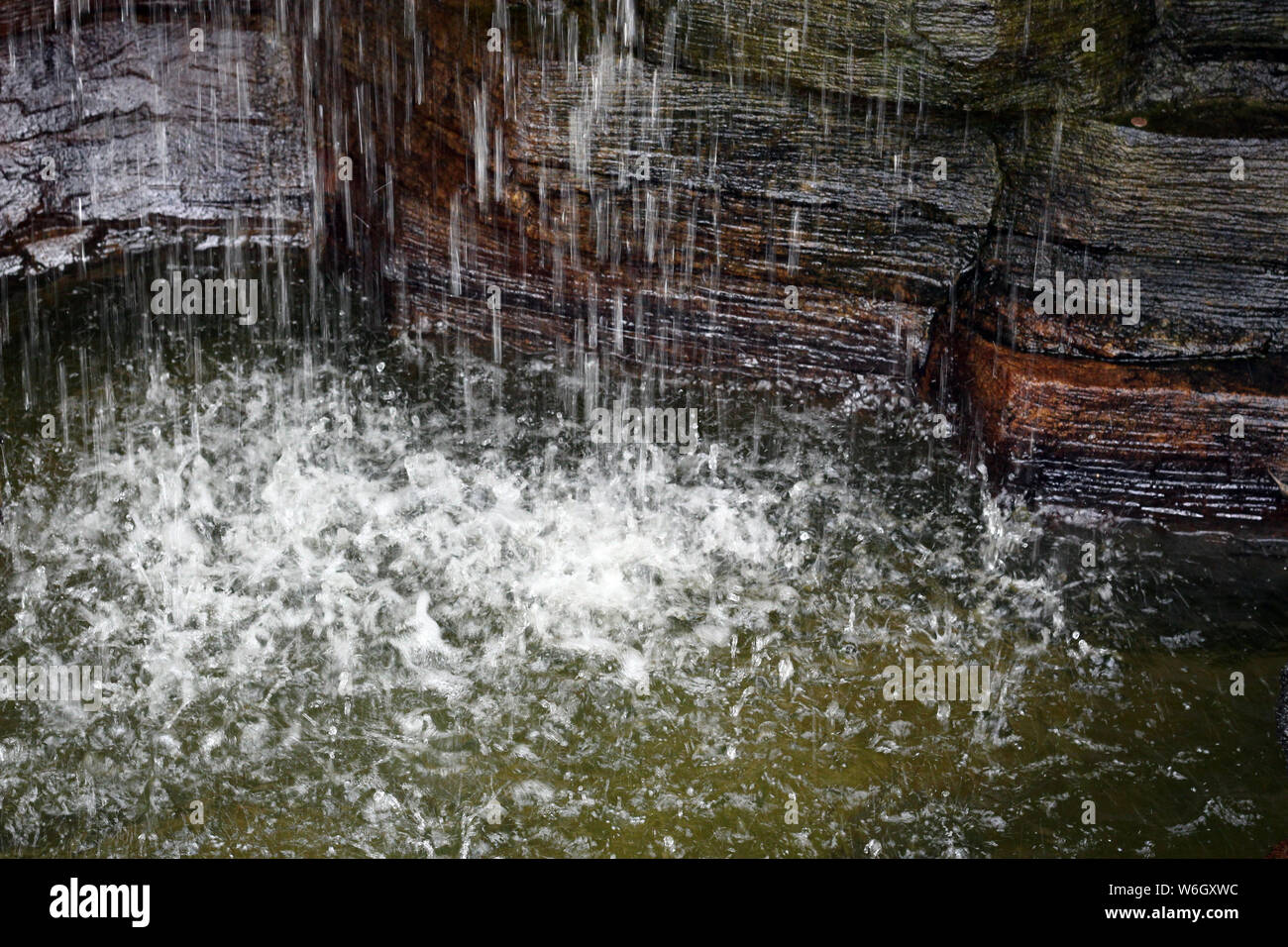 Close up of water splashing at the bottom of a waterfall Stock Photo ...