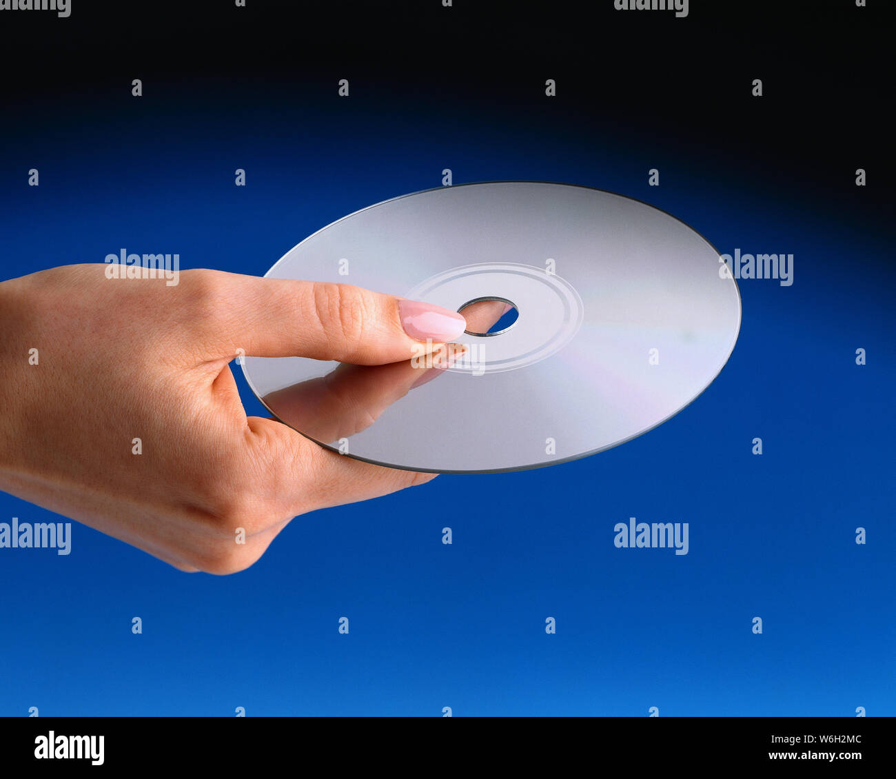 Hand holding up dvd cd hi-res stock photography and images - Alamy