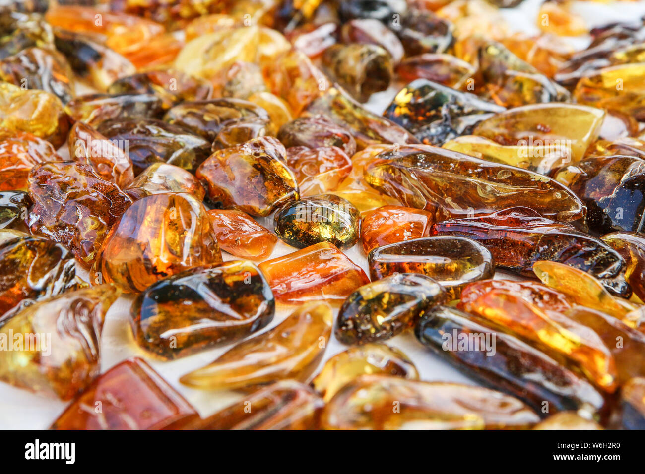 The detail picture of many small different colored amber pieces Stock ...