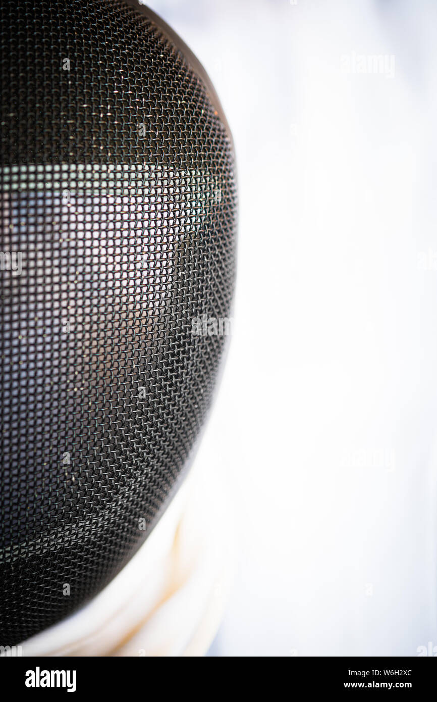 Extreme close up of fencing mask, sport equipment protection safety ...